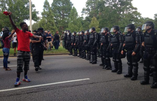 PHOTO: Shotgun-wielding Black Panther faces off with Baton Rouge riot ...