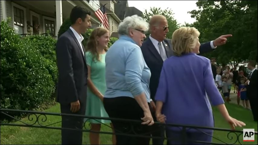 STEADY AS SHE GOES: Hillary holds onto railing, table, chair during ...